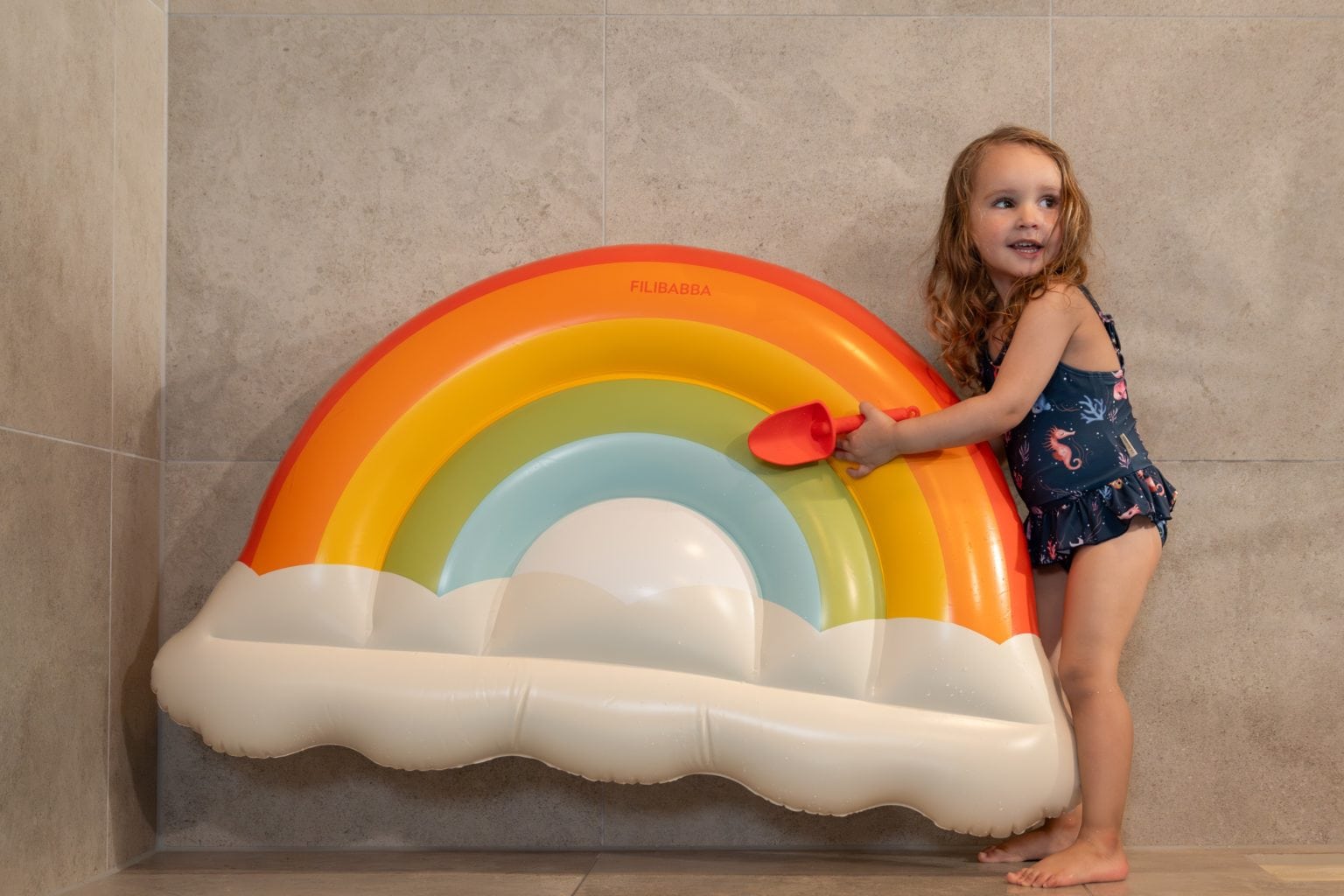 Colourful rainbow pool float | Shop online hos - FILIBABBA